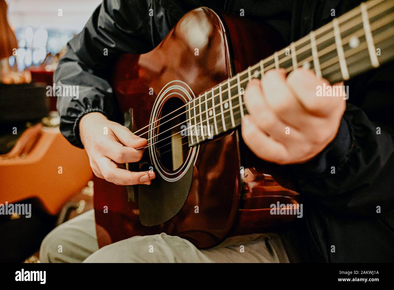 Sitting holding music musical instrument guitar skill playing musician ...