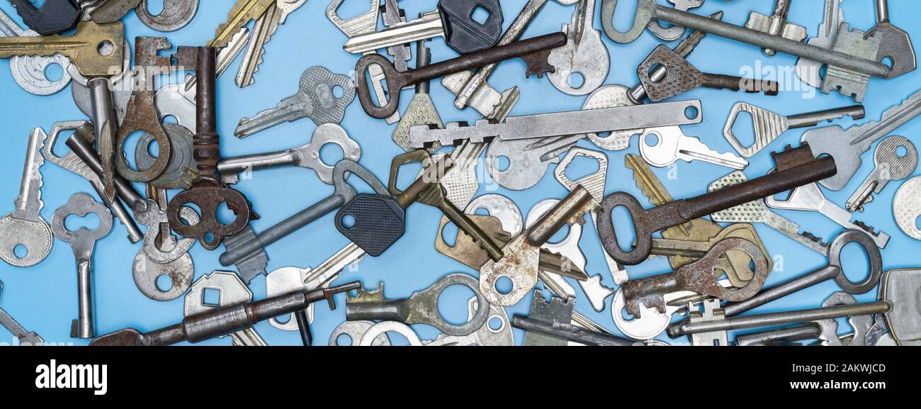 Keys set on blue background. Door lock keys and safes for property ...