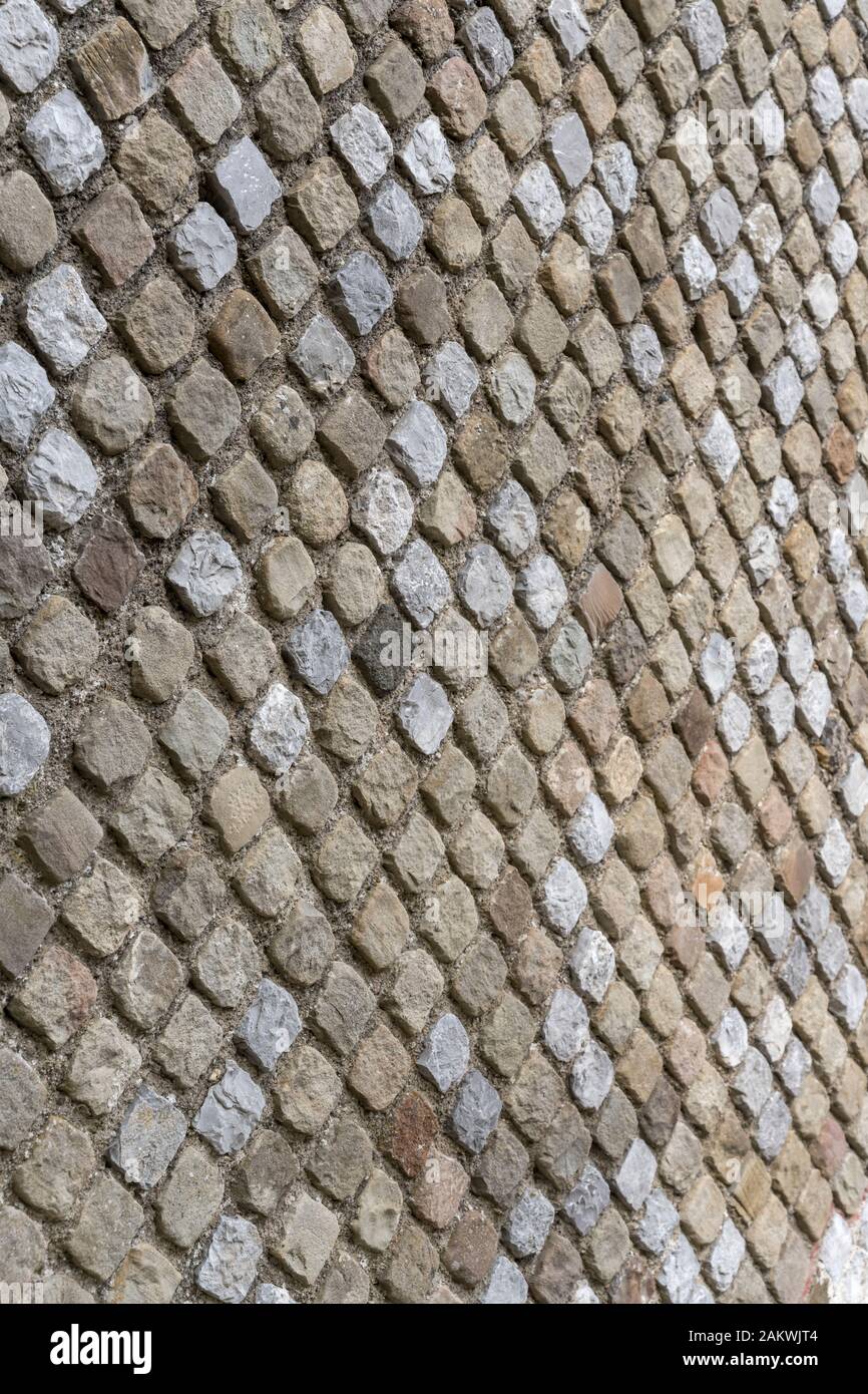 ancient Roman wall made of cubic stones, shot at archeological site of ...