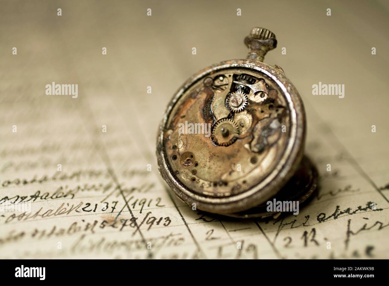 Rusted antique pocket watch on an old notebook Stock Photo - Alamy