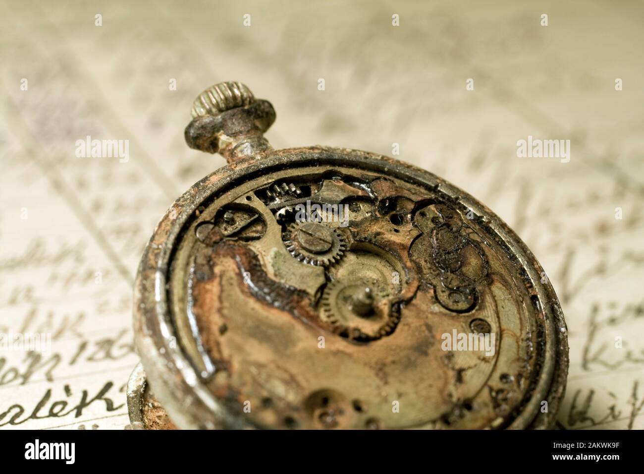 Rusted antique pocket watch on an old notebook Stock Photo - Alamy