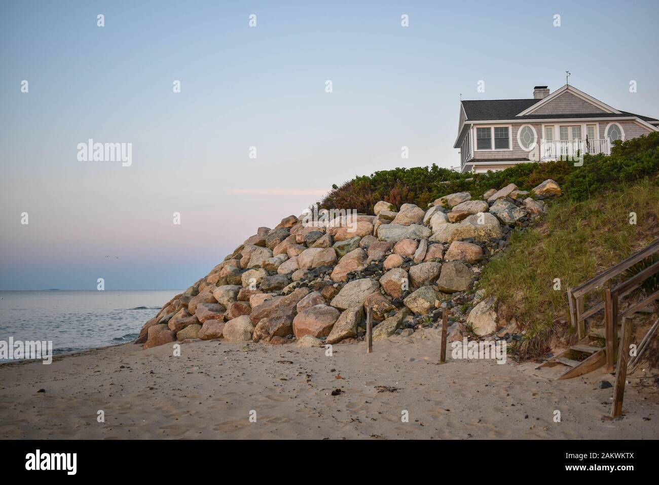Sun rising on the beach Stock Photo - Alamy