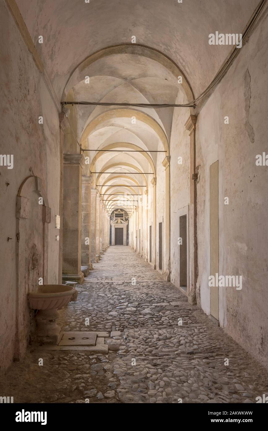 arched covered walkway at cloister of ancient Baroque San Lorenzo ...