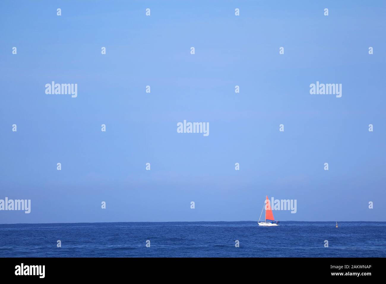 Red Sail Yacht in Sailing on the Deep Blue Ocean Stock Photo - Alamy