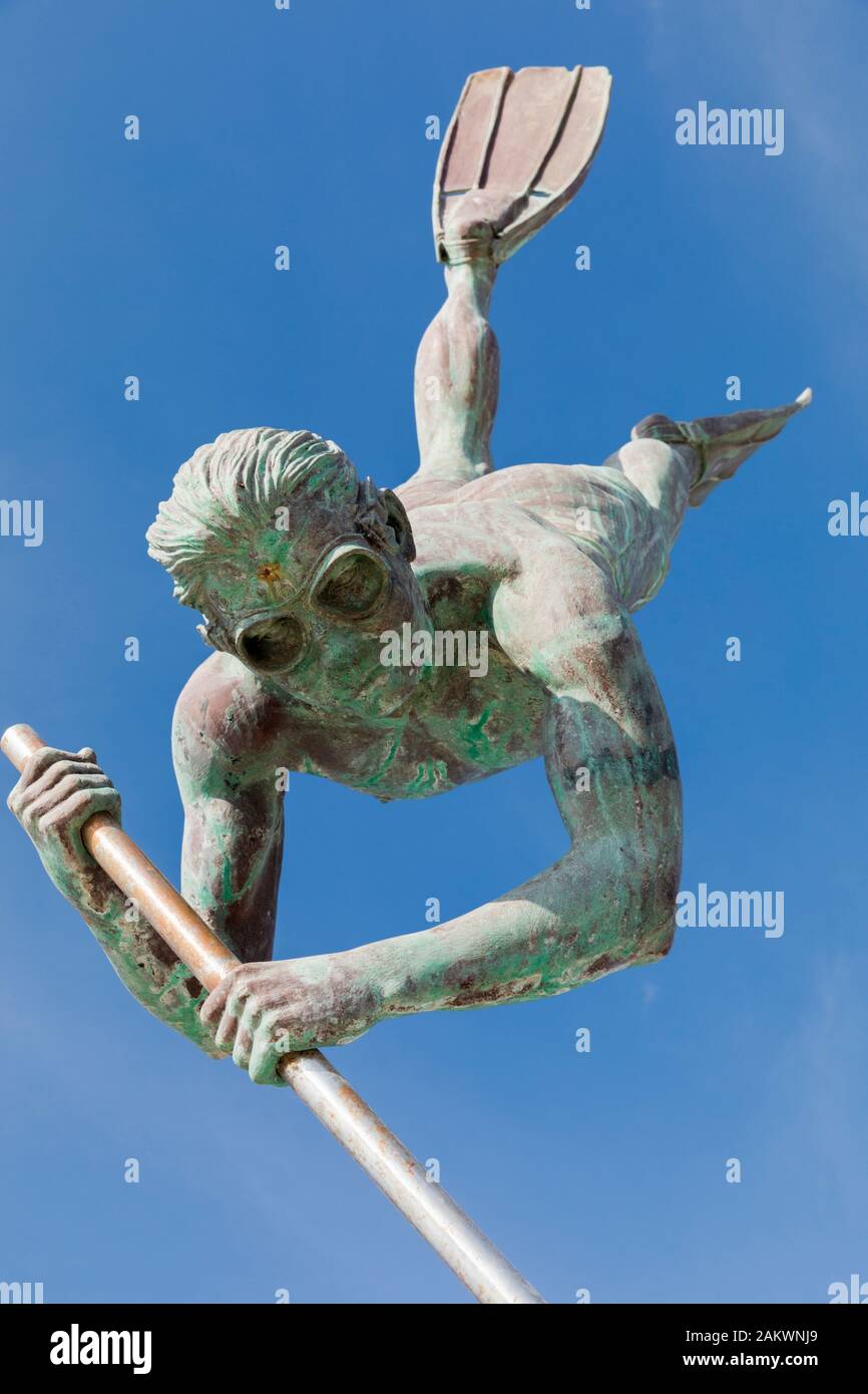 Mexico, Nayarit, Bucerias, The sculpture is the figure of a man diving ...