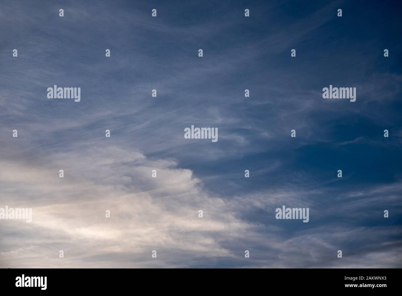 White wispy clouds drift across hi-res stock photography and images - Alamy