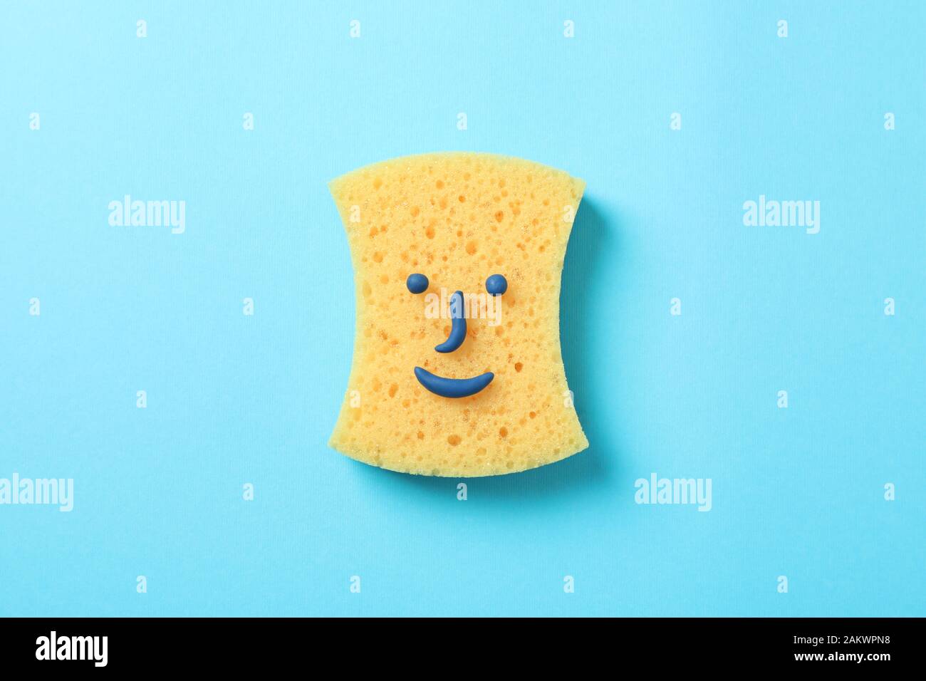 Sponge with smiley face on blue background, top view Stock Photo - Alamy