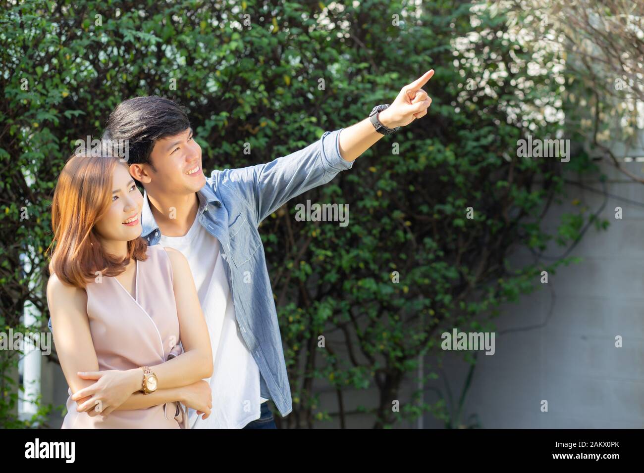 Person pointing at two others hi-res stock photography and images - Alamy