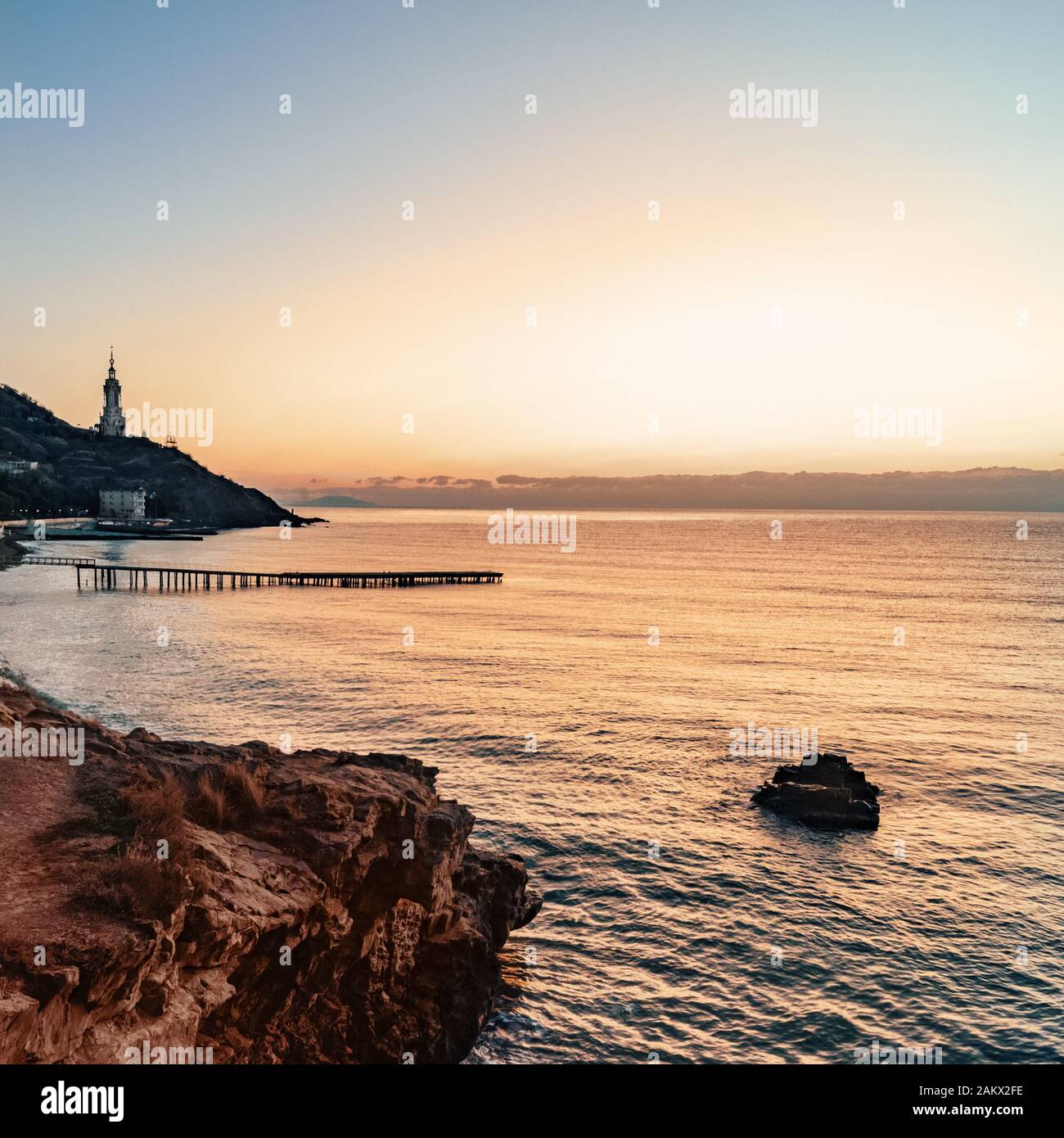 Landscape sea, rocks, sky church lighthouse pier Stock Photo - Alamy