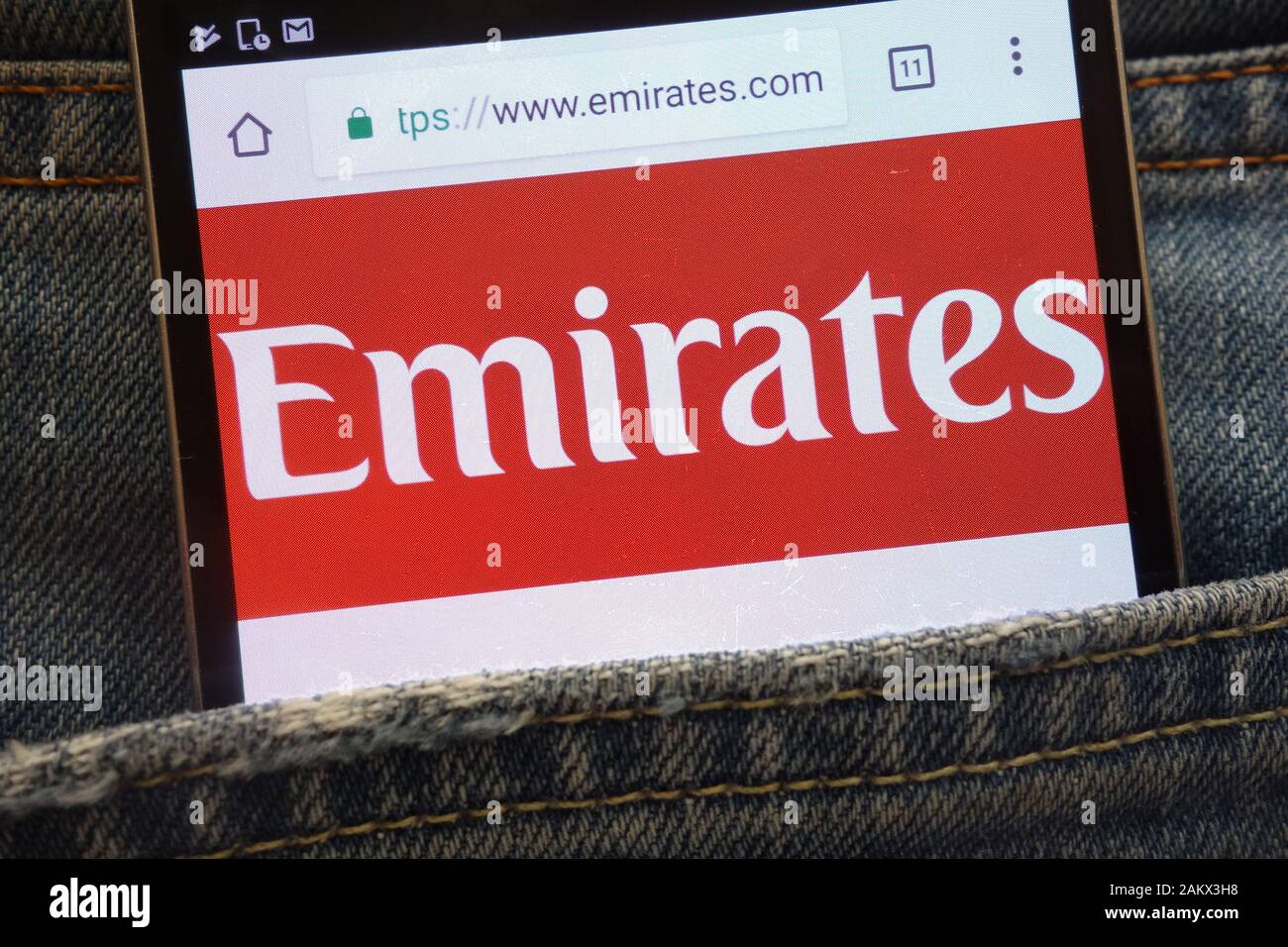 Emirates website displayed on smartphone hidden in jeans pocket Stock ...