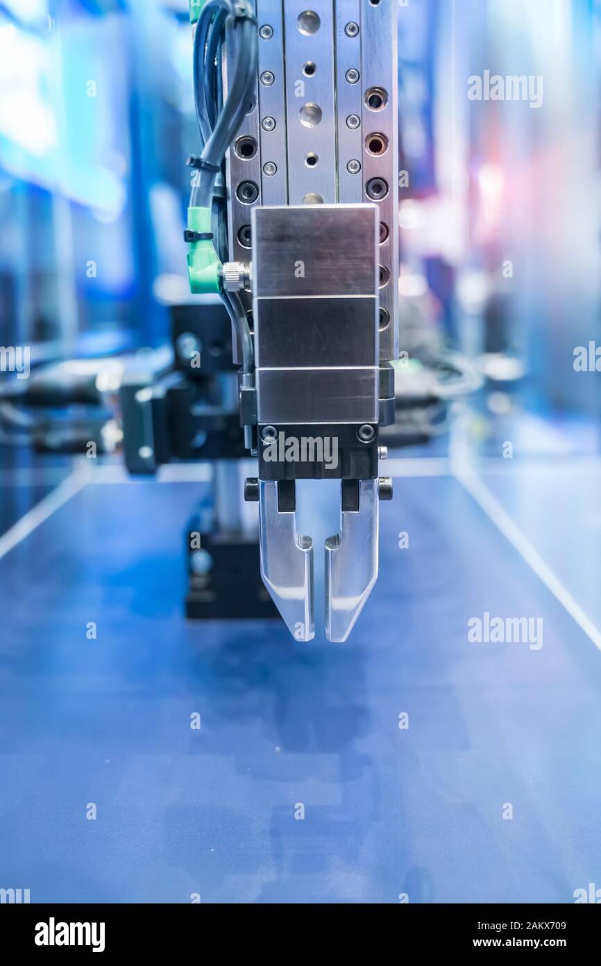 robotic arm catch for electronic assembly line. The robot for smart ...