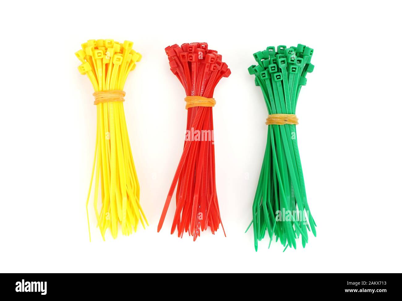 Different colors of plastic nylon cable ties closeup on white ...
