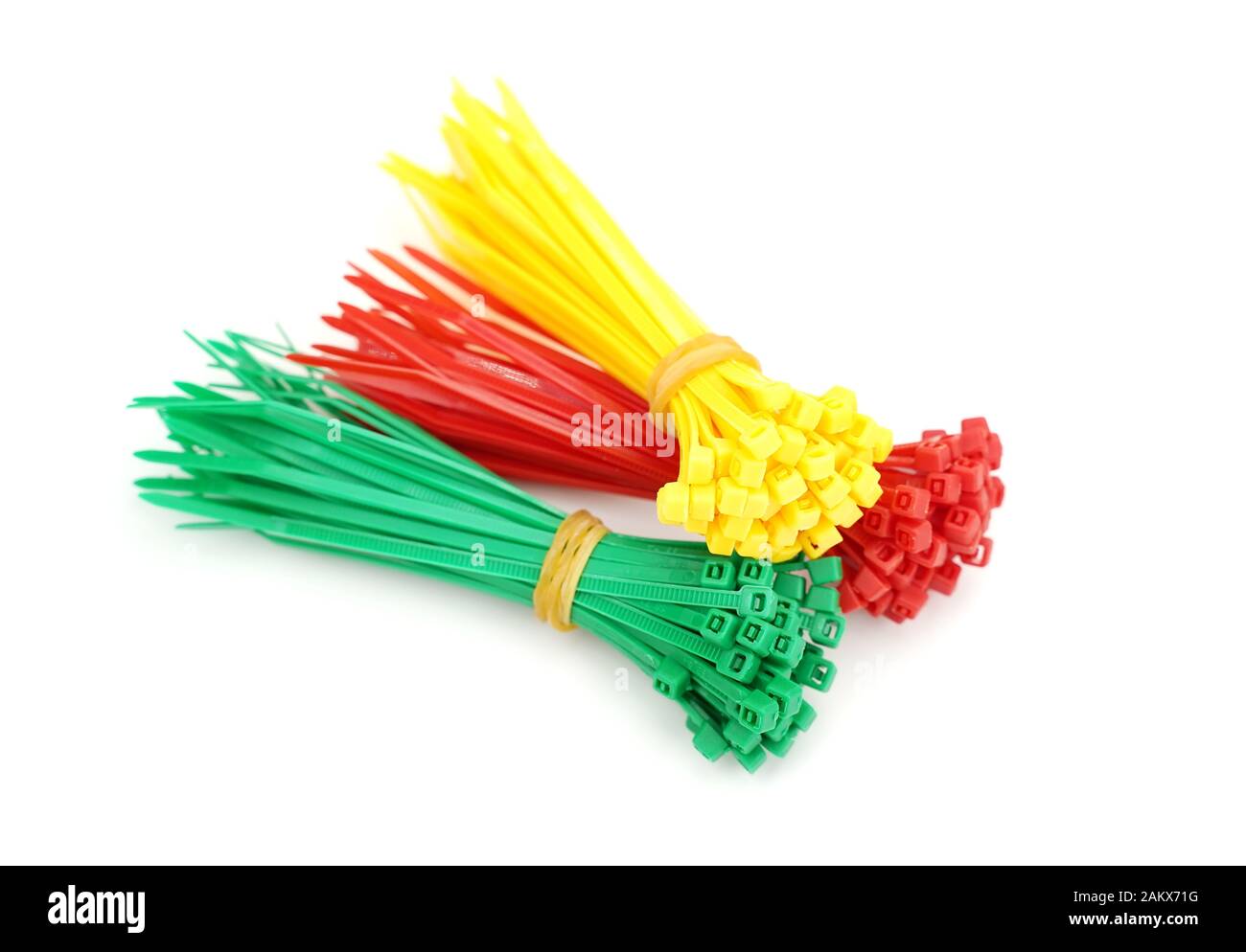 Different colors of plastic nylon cable ties closeup on white ...