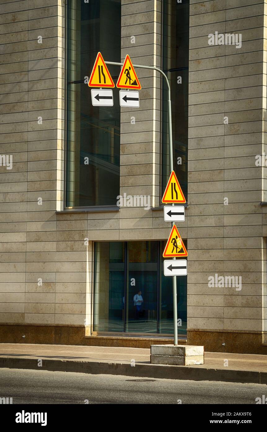 Road signs on the street as a warning to car drivers Stock Photo - Alamy