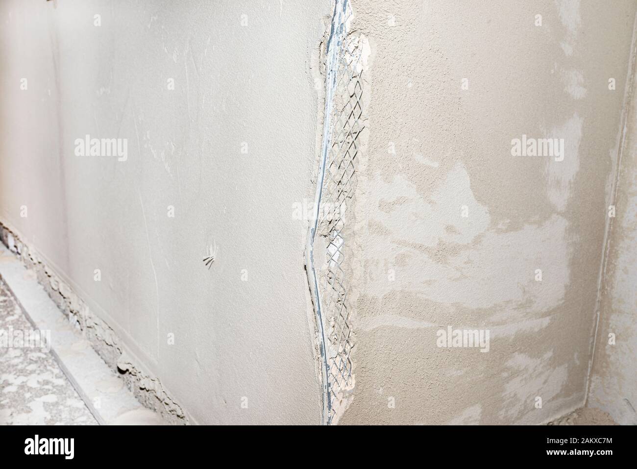 Damaged corners of plastered walls, visible aluminum corner Stock Photo ...