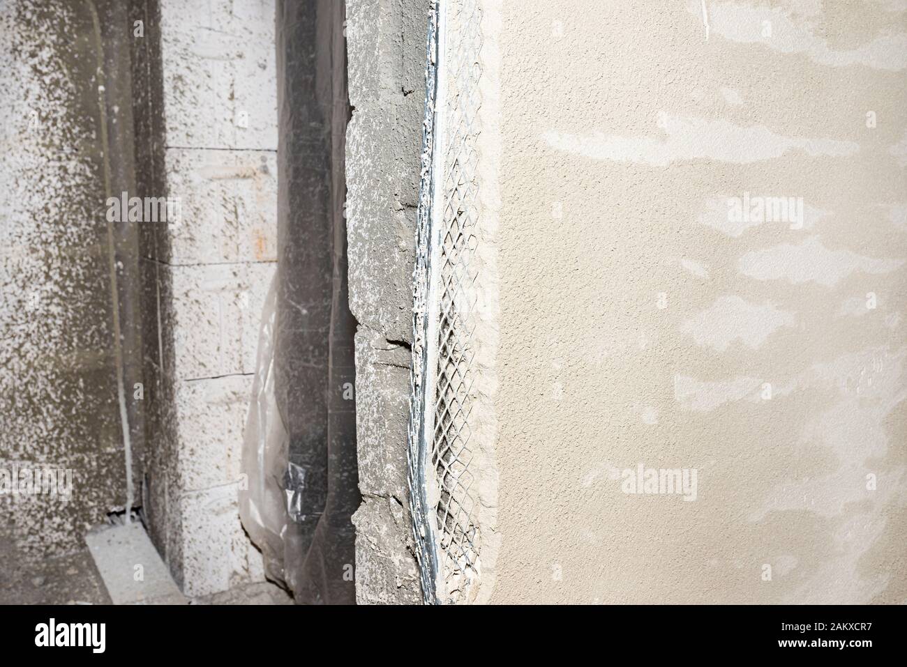 Damaged corners of plastered walls, visible aluminum corner Stock Photo ...