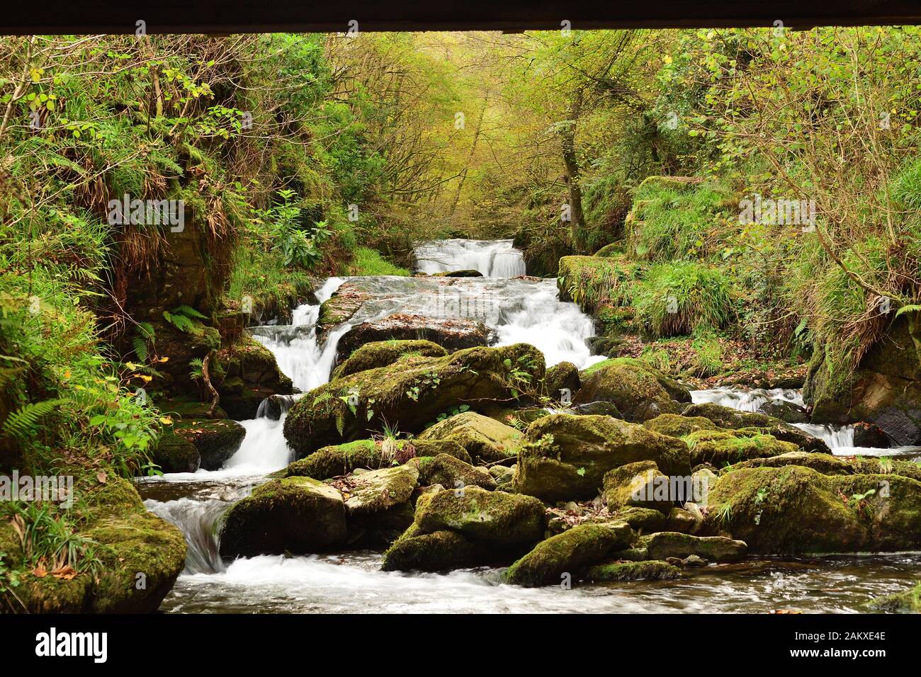 Long exposure of the waterfall at Watersmeet in Devon Stock Photo - Alamy