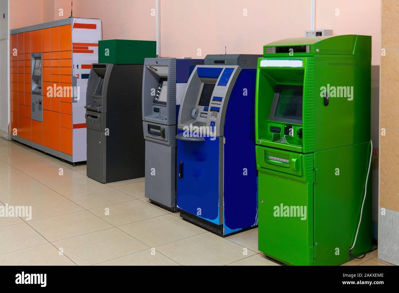 A line of multi-colored ATM in a shopping center Stock Photo - Alamy