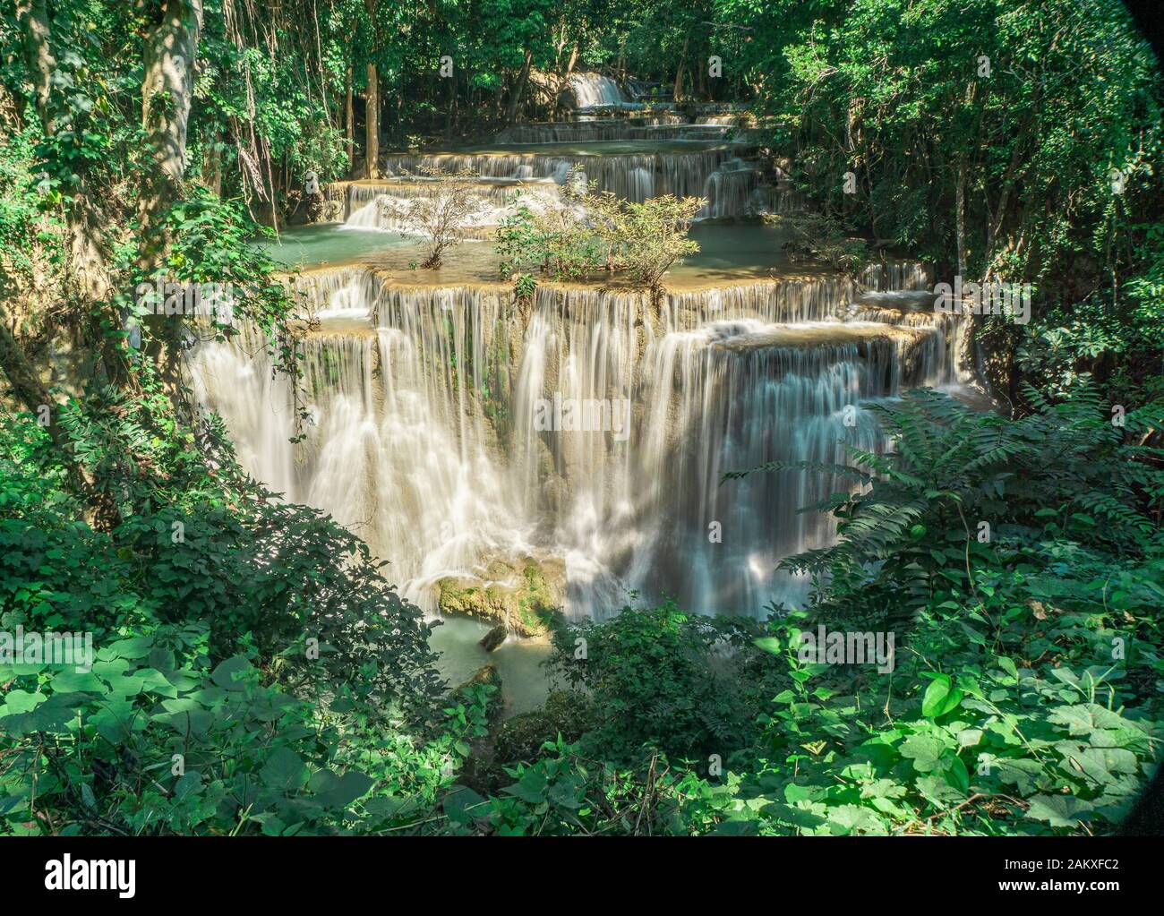 Many waterfalls flow in the frame of plants and green trees. Huai Mae ...
