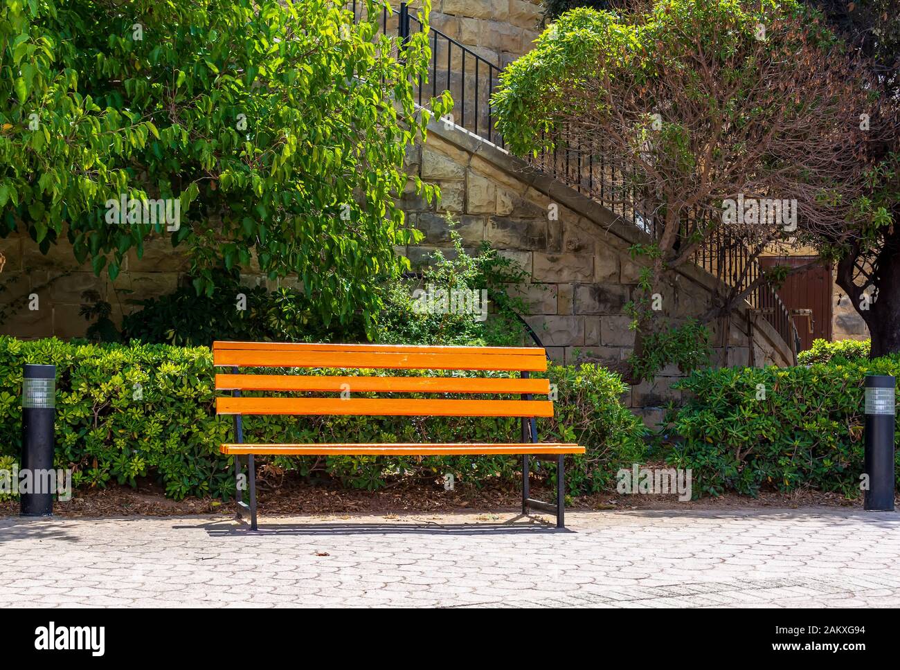 Bright yellow bench in Independence Gardens park Stock Photo - Alamy