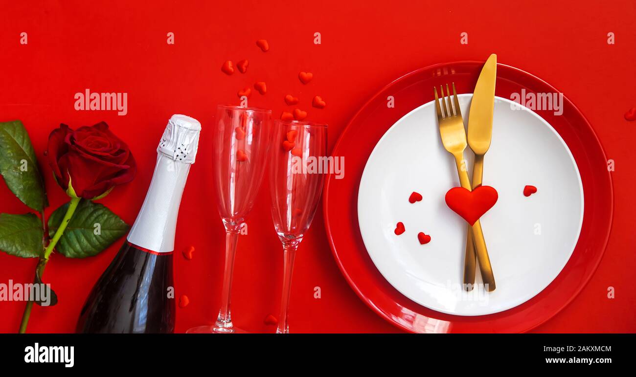Romantic dinner for Valentine's day on a red background. Selective ...