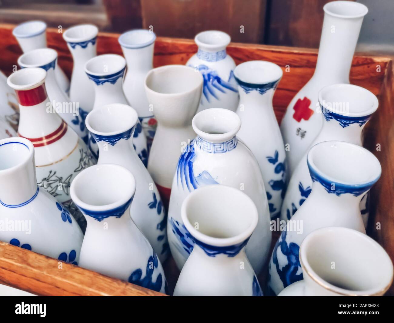 Collection of traditional Japanese ceramic white and blue sake pitchers ...