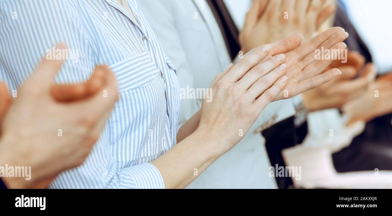 Business people clapping and applause at meeting or conference, close ...