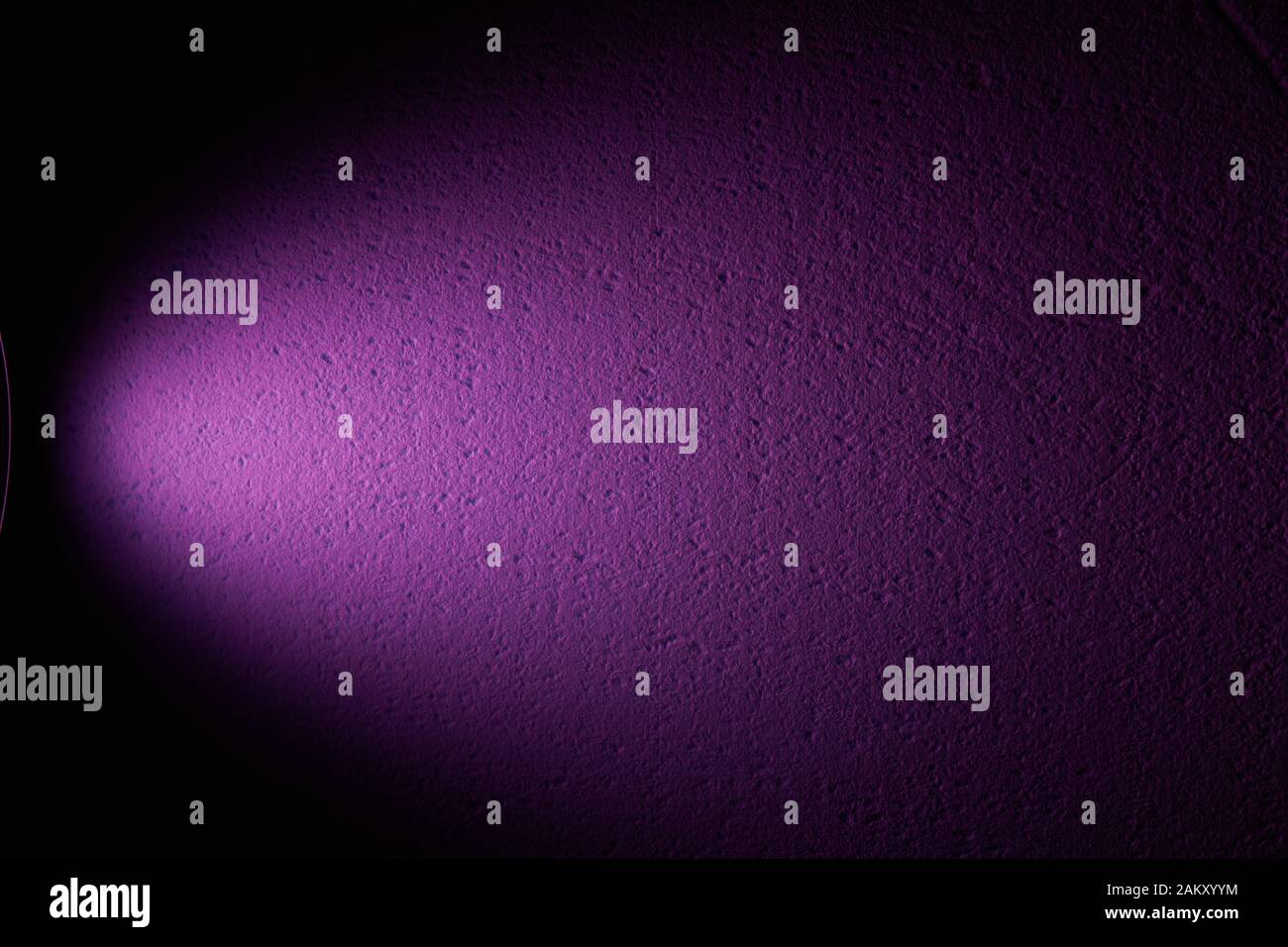 On a black background wide beam violet color Stock Photo - Alamy