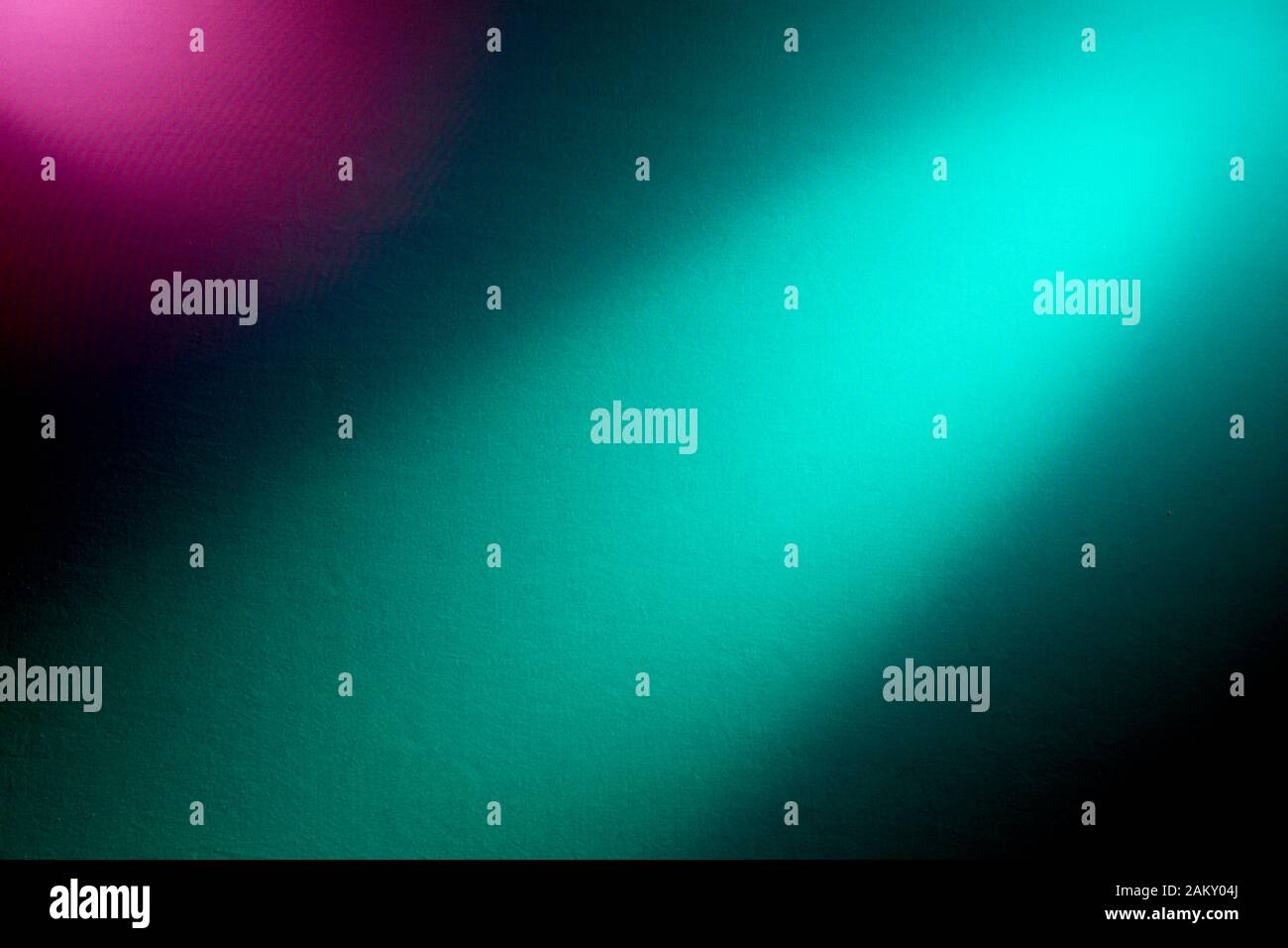Turquoise ray of light and pink spot on a black background Stock Photo ...