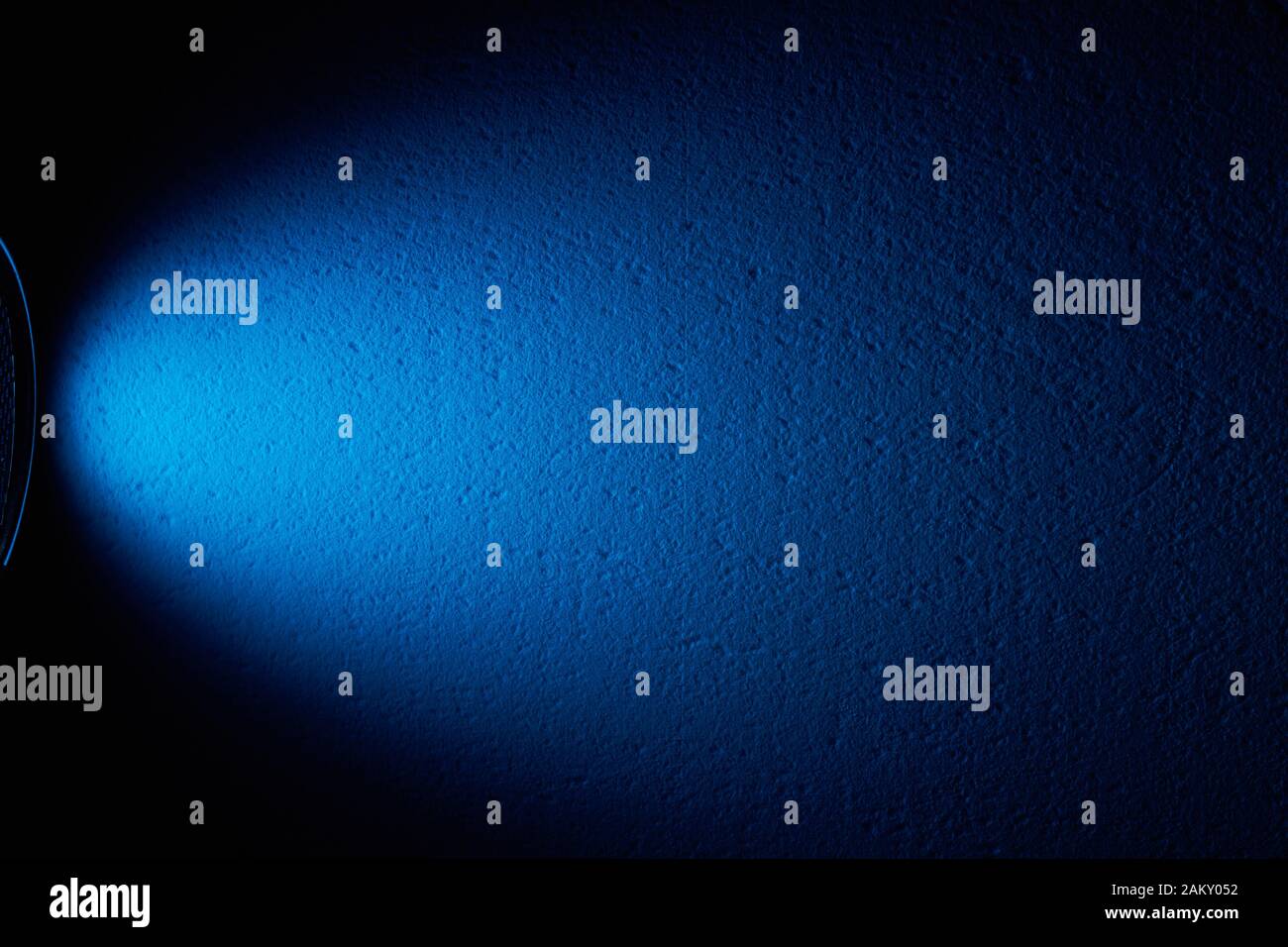 On the textural background wide beam lantern Stock Photo - Alamy