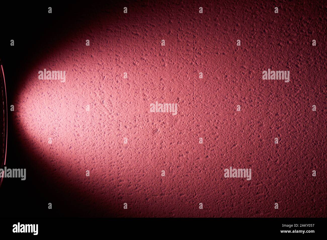 Pink wide beam of light on a black background Stock Photo - Alamy