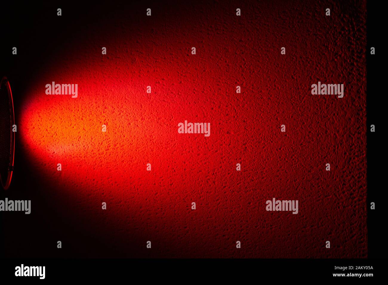 Red wide beam of light on a black background Stock Photo - Alamy