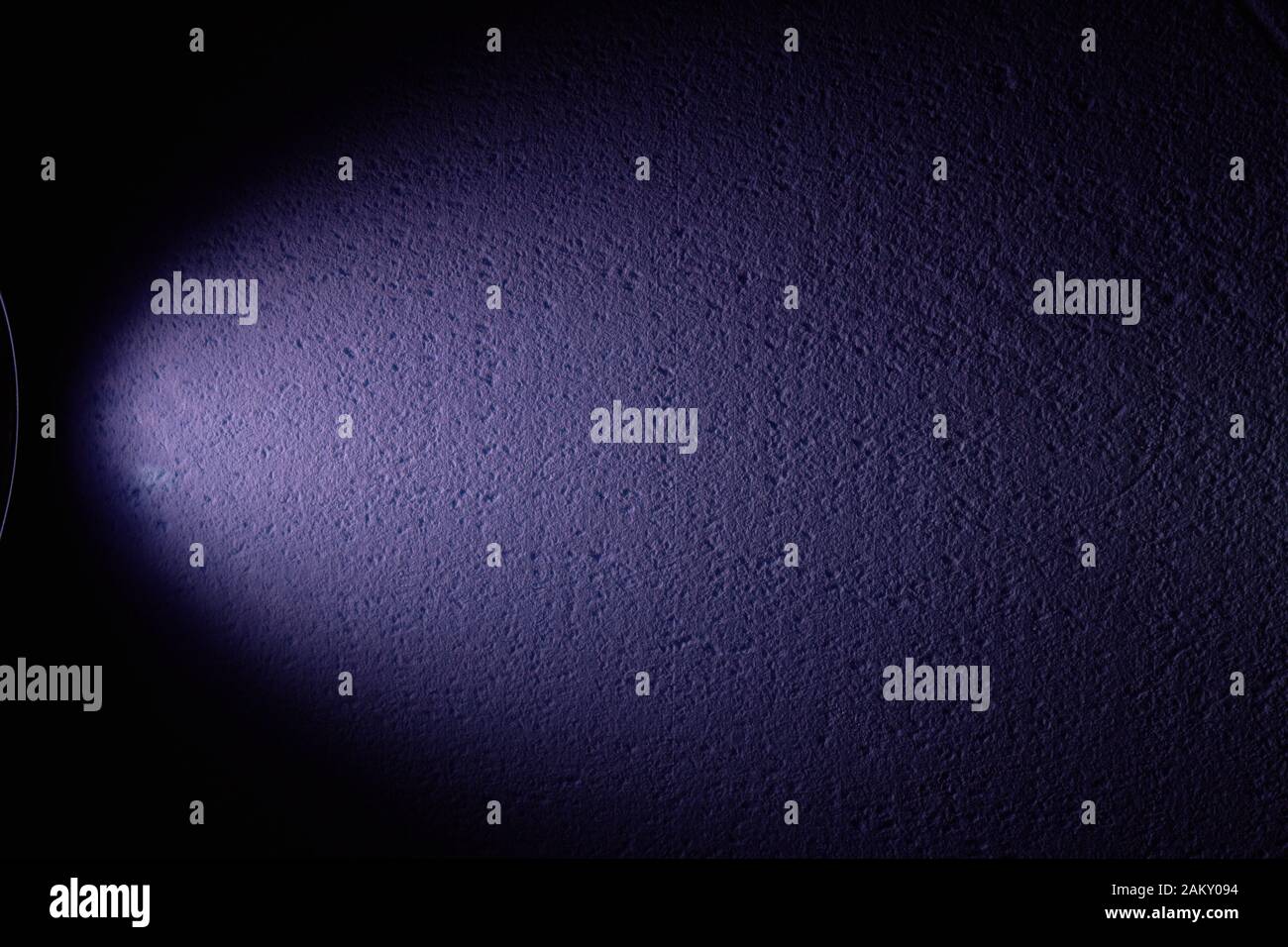 Wide ray of violet color on a black background Stock Photo - Alamy