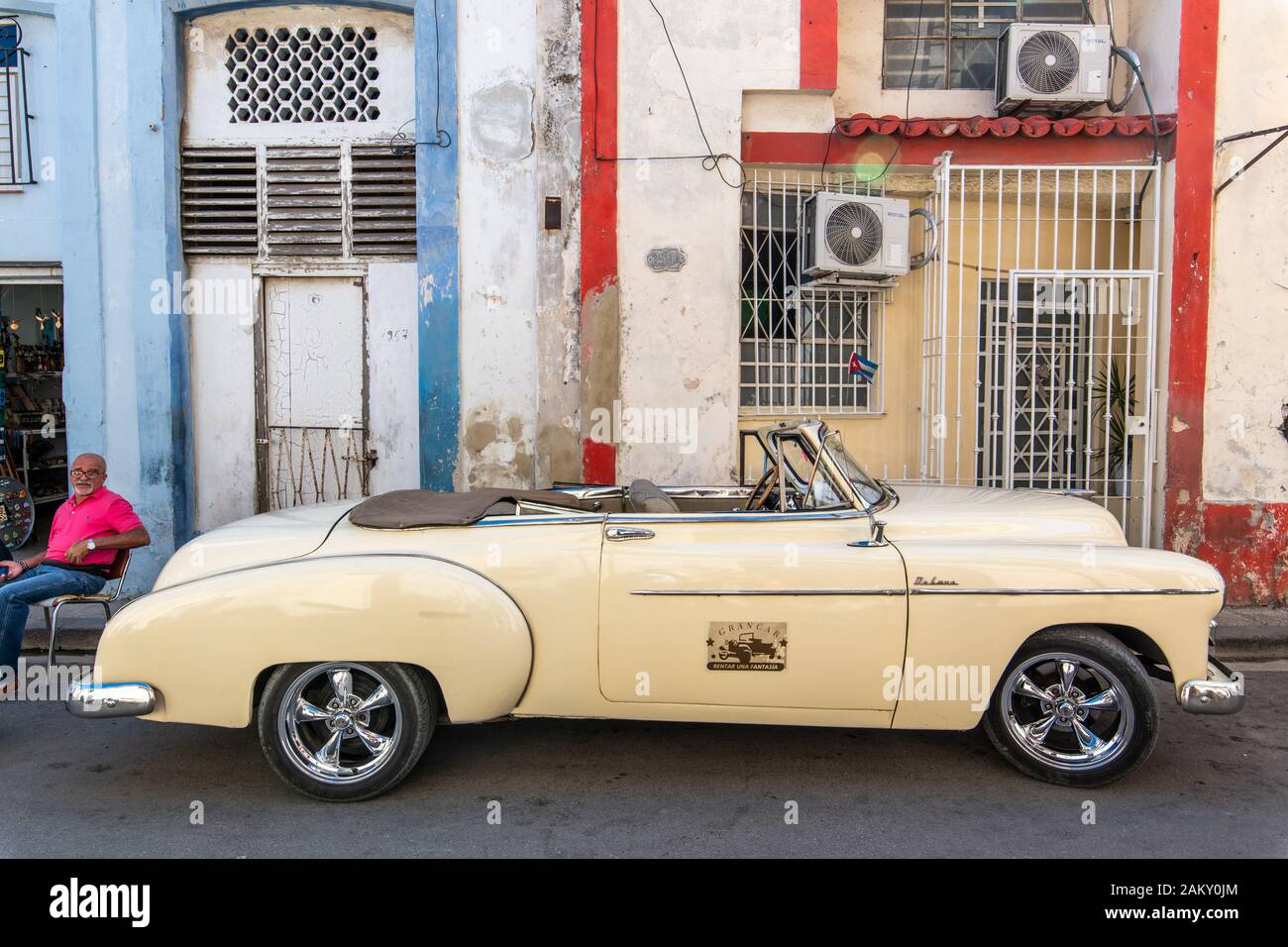 A bright classic convertible parked on the street in Havana, Cuba Stock ...