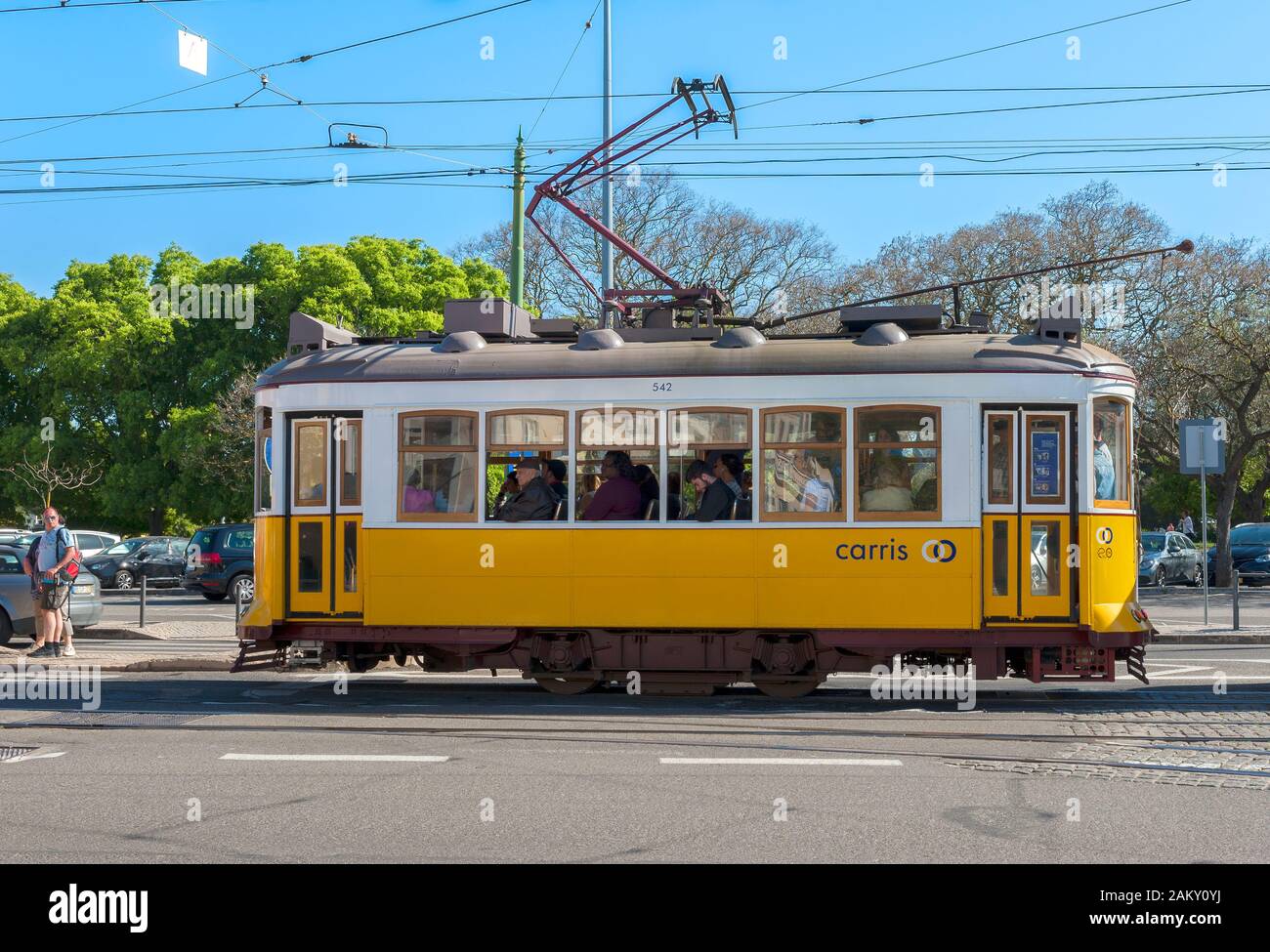 Traditional yellow trams at the streets of Lisboa Stock Photo - Alamy