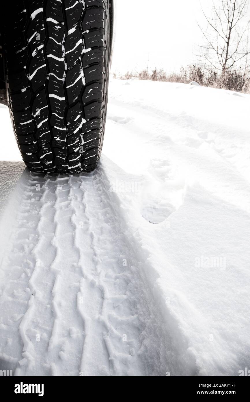 Tire in snow Stock Photo - Alamy