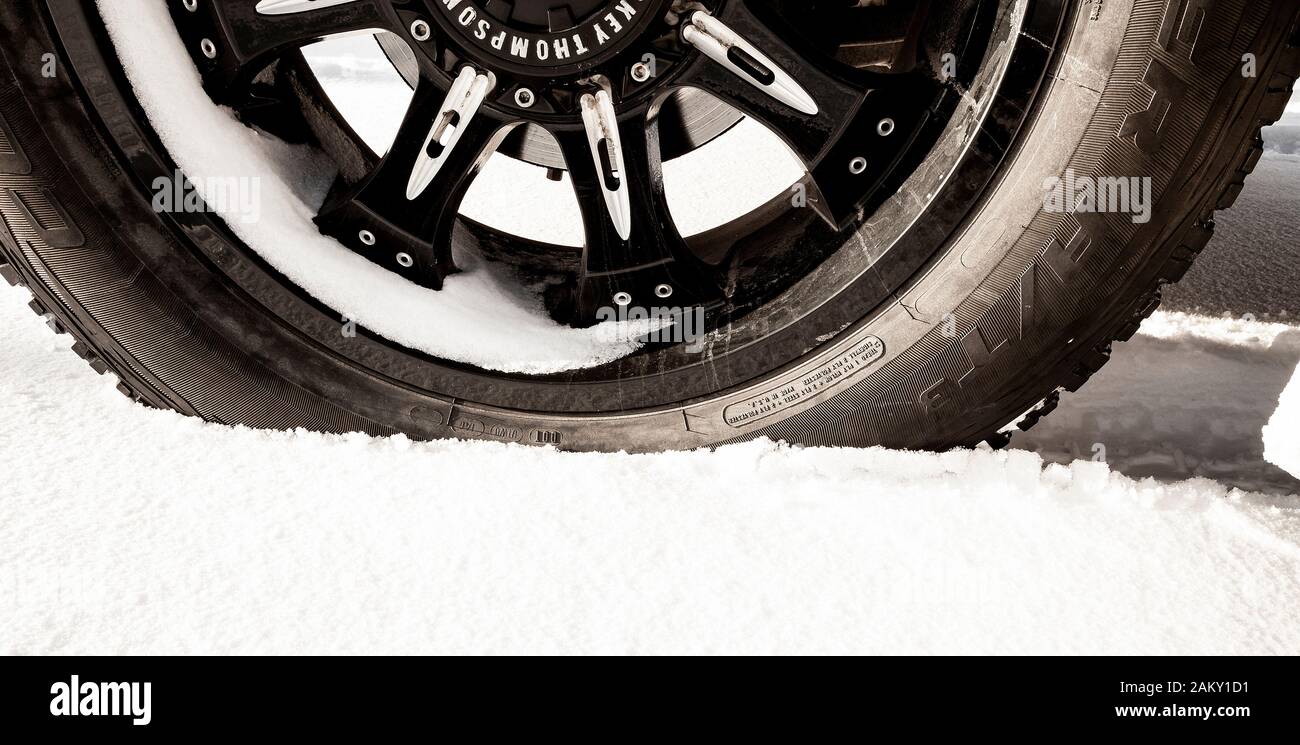 Tire in snow Stock Photo - Alamy