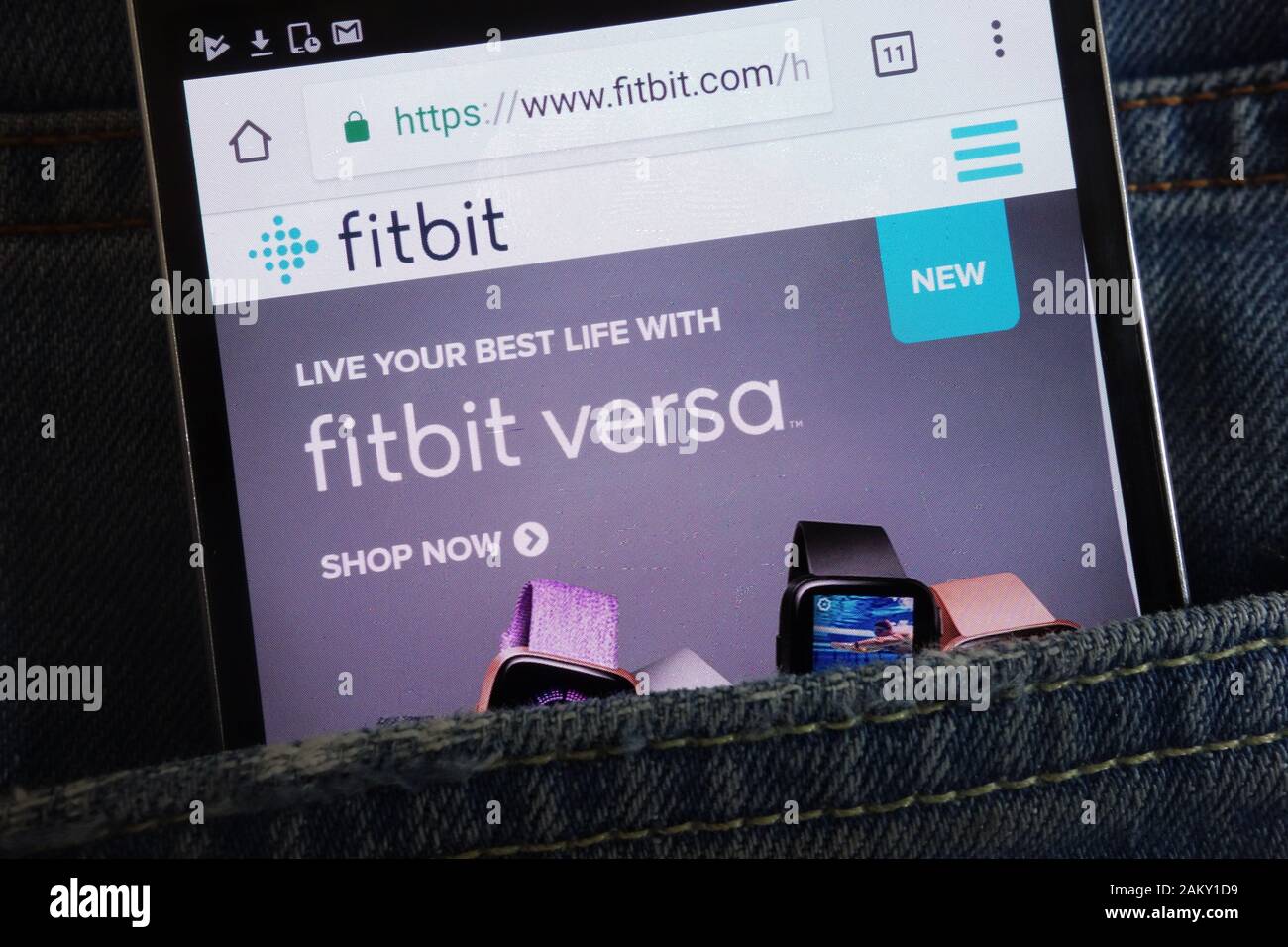 Fitbit website displayed on smartphone hidden in jeans pocket Stock ...