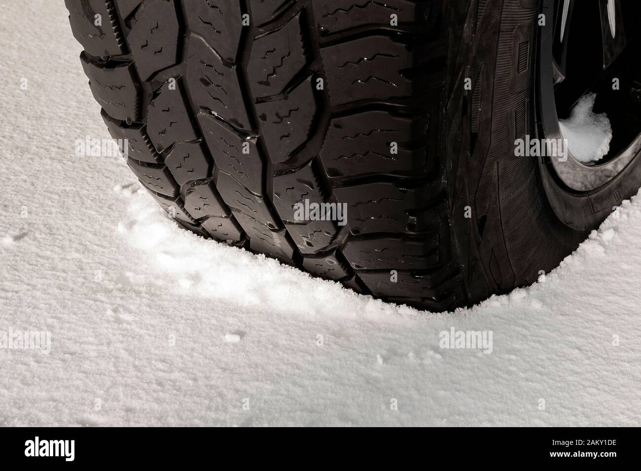 Tire in snow Stock Photo - Alamy