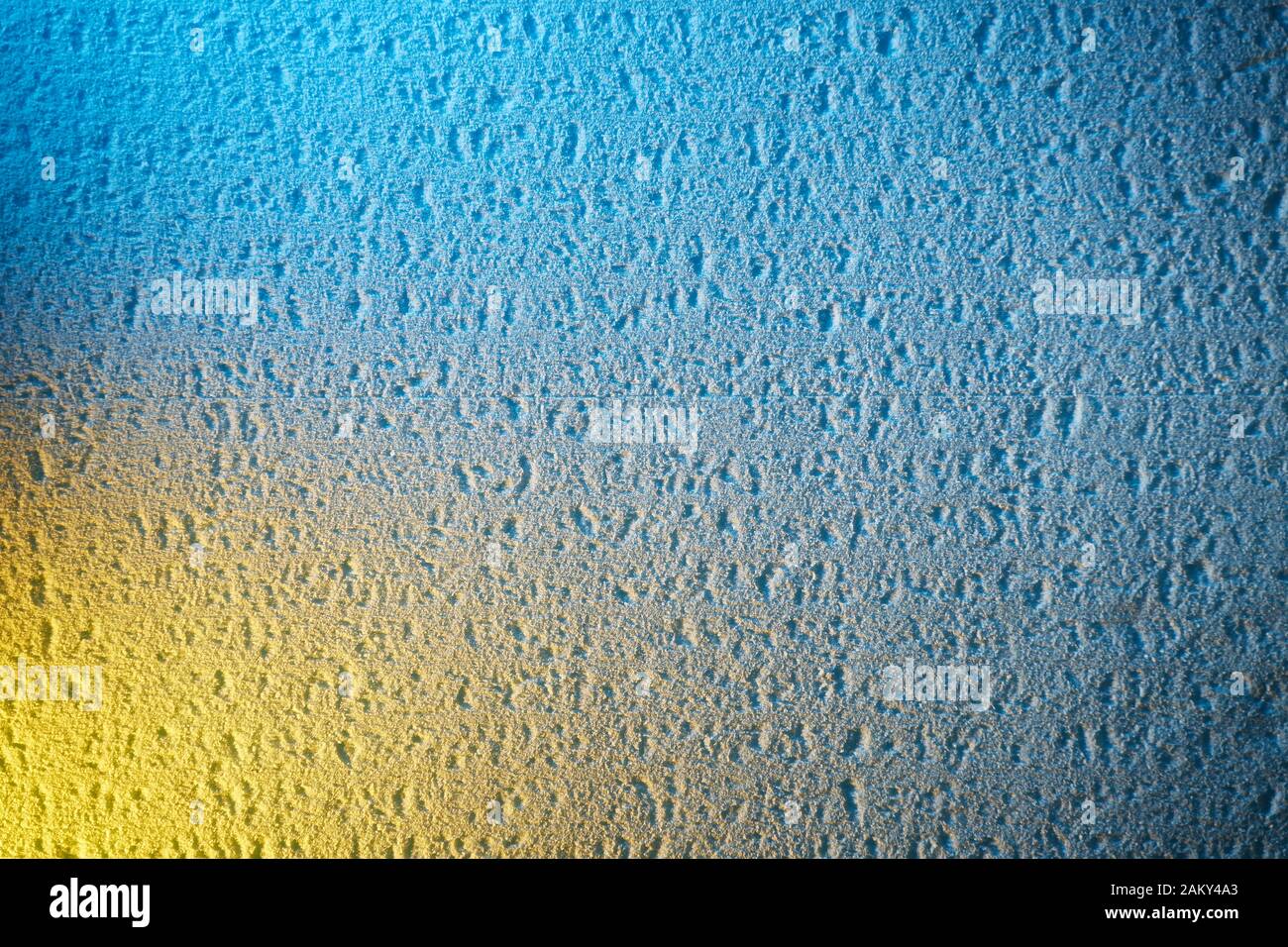 Soft yellow light on a blue background Stock Photo - Alamy