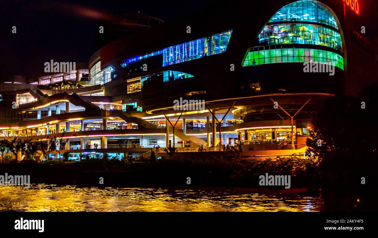 Shopping center building at night in the riverbank Stock Photo - Alamy
