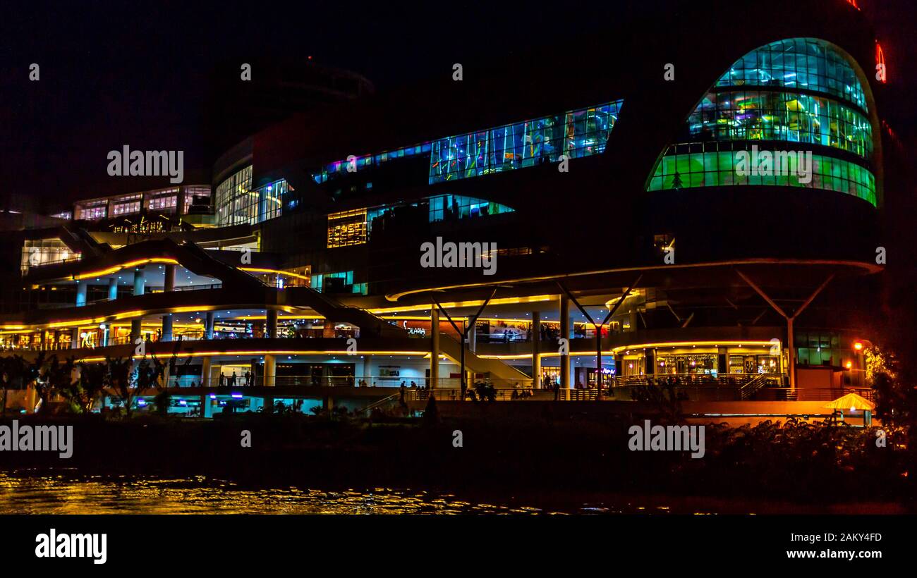 Shopping center building at night in the riverbank Stock Photo - Alamy