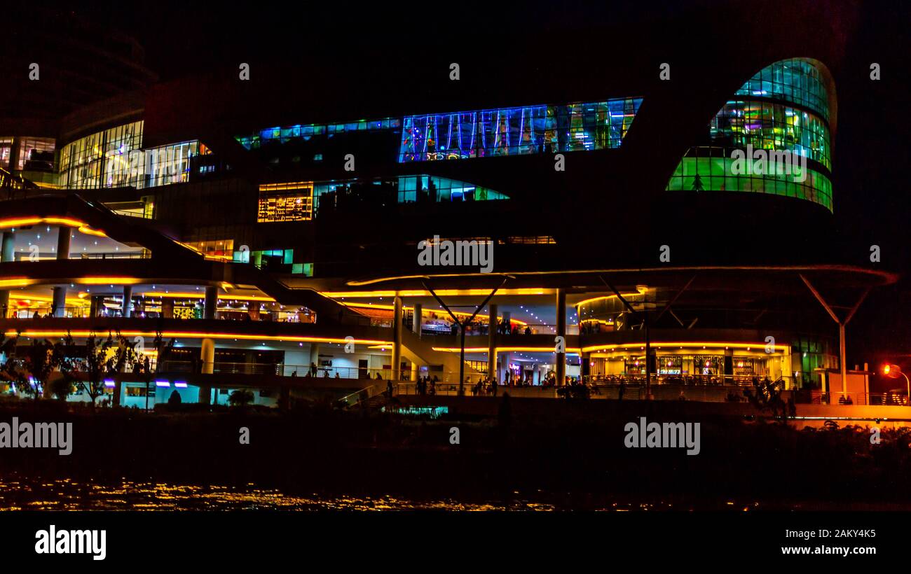 Shopping center building at night in the riverbank Stock Photo - Alamy