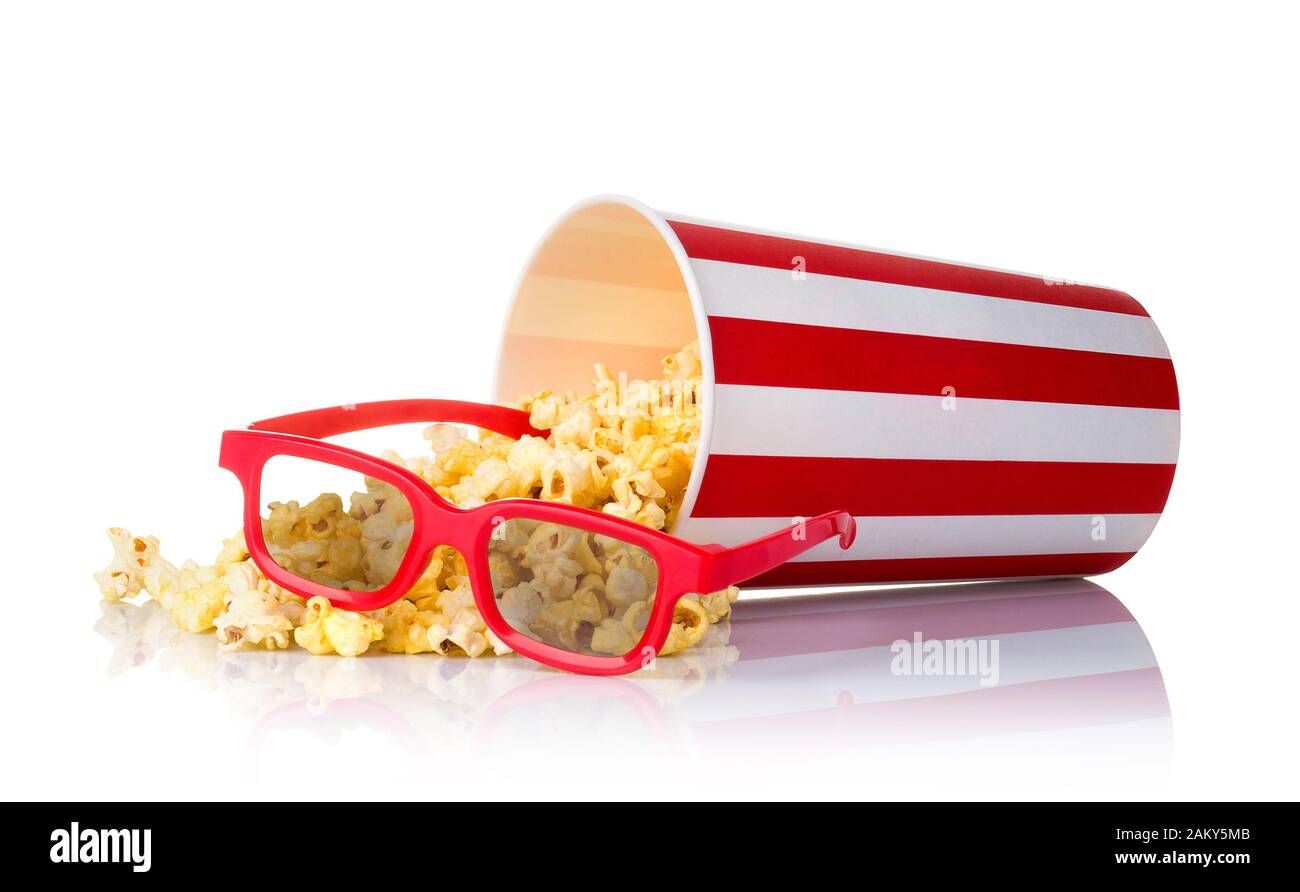 Scattered popcorn from paper striped bucket isolated on white ...