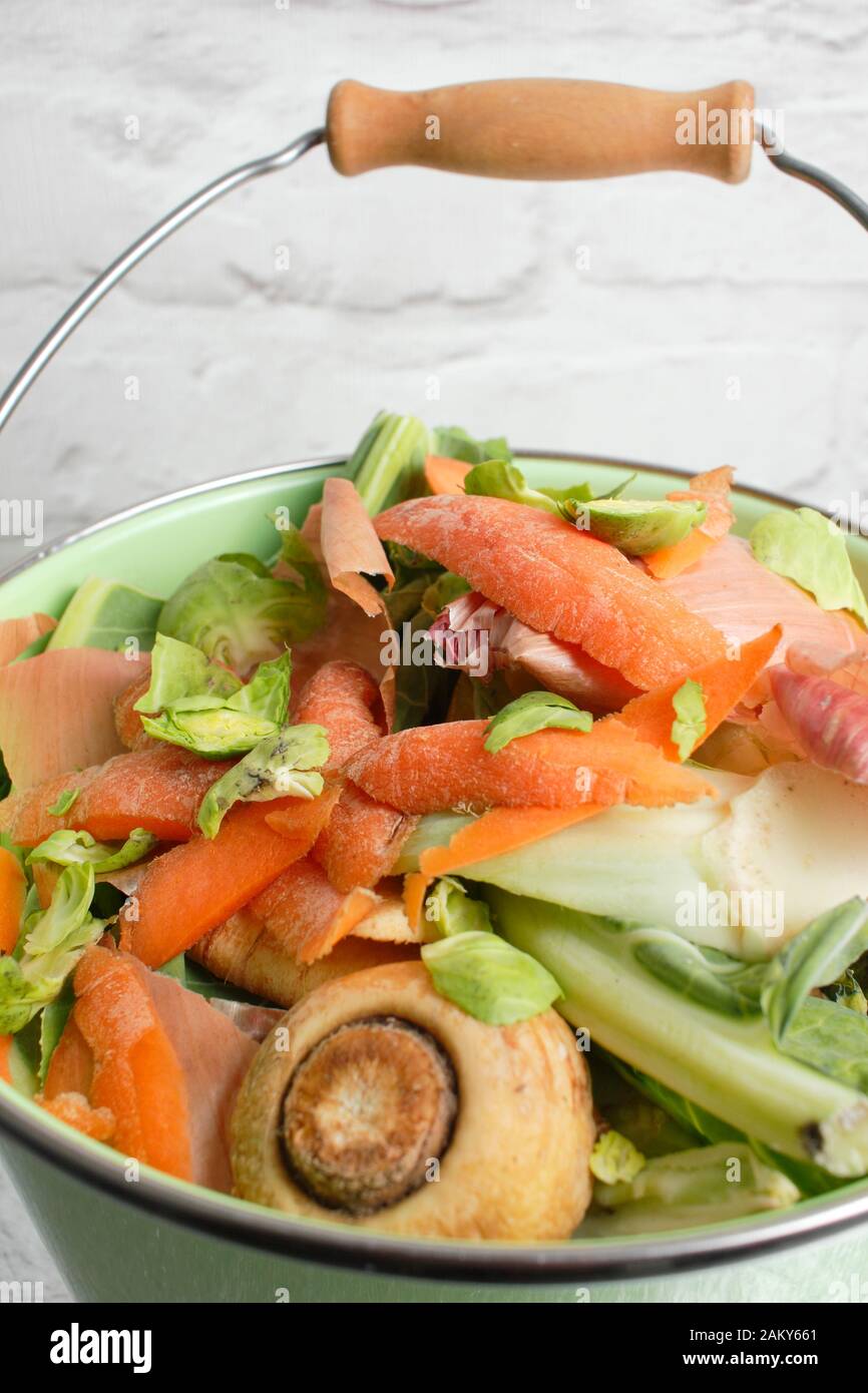 Vegetable and fruit waste collected into a bucket for home composting ...