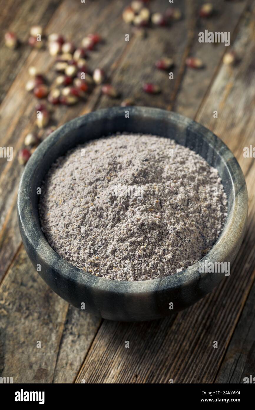 Raw Blue Organic Cornmeal Flour in a Bowl Stock Photo - Alamy