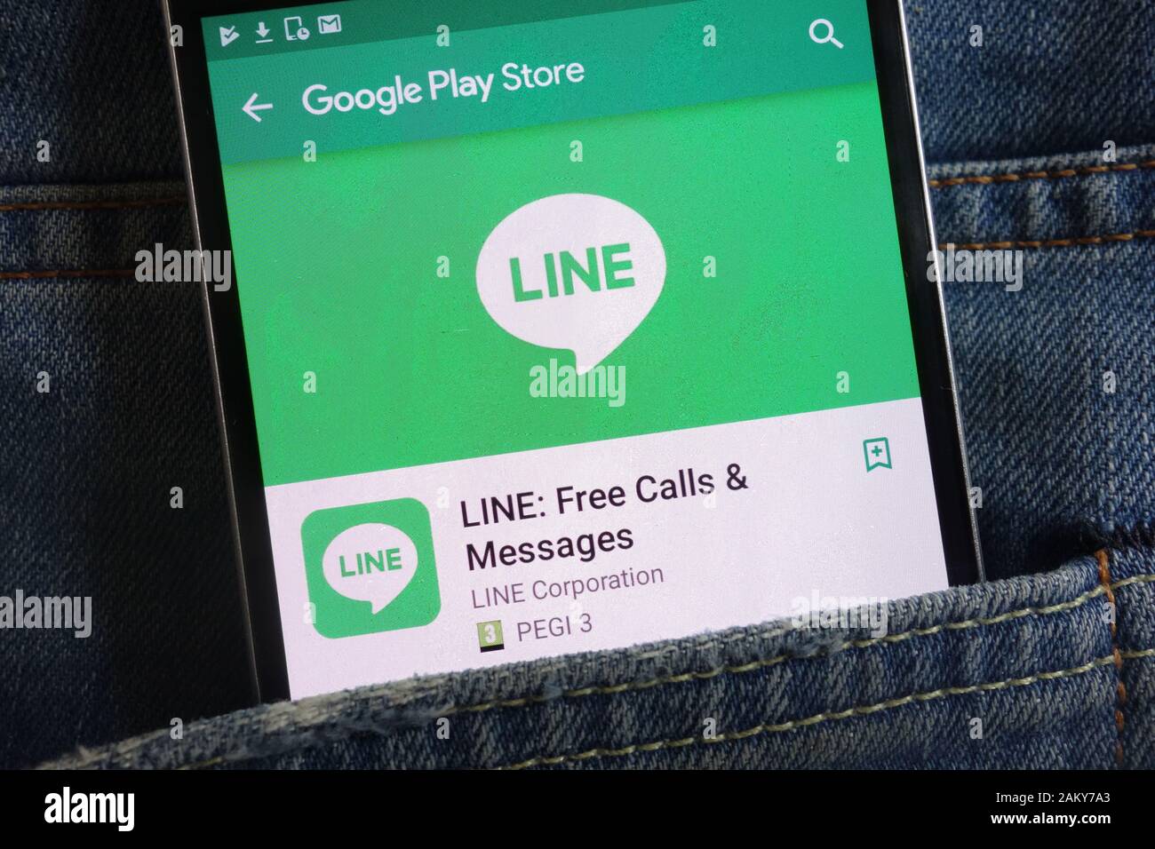 Line app on Google Play Store website displayed on smartphone hidden in ...