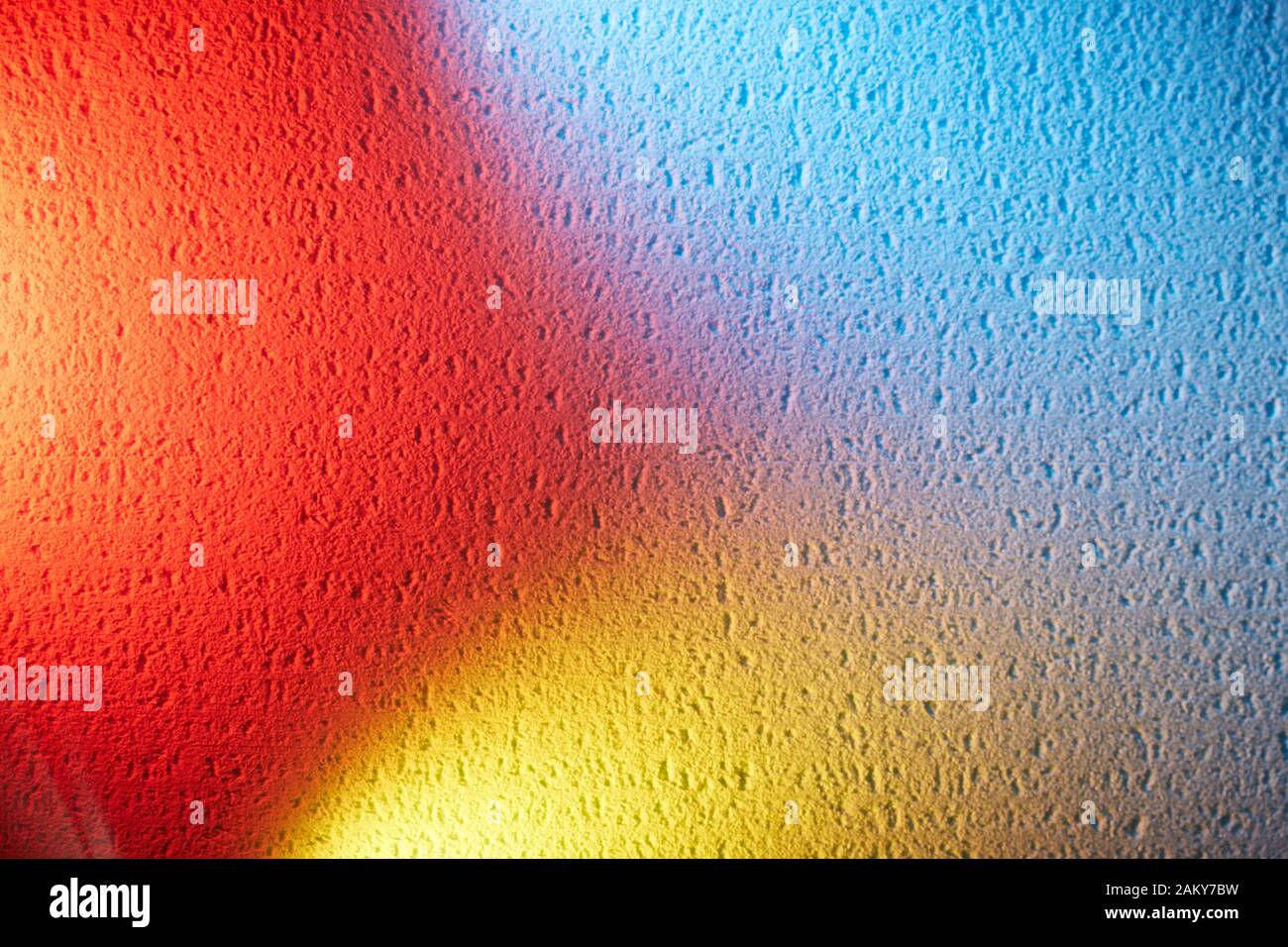 Merging red yellow and blue on one background Stock Photo - Alamy