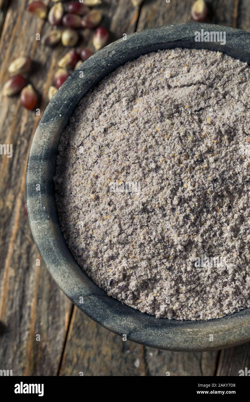 Raw Blue Organic Cornmeal Flour in a Bowl Stock Photo - Alamy