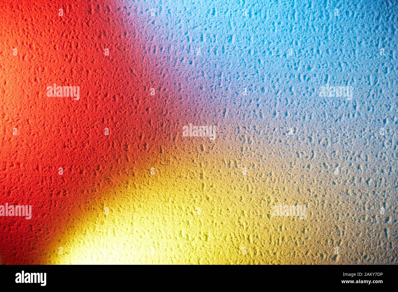 Merging three colors on a textural background Stock Photo - Alamy